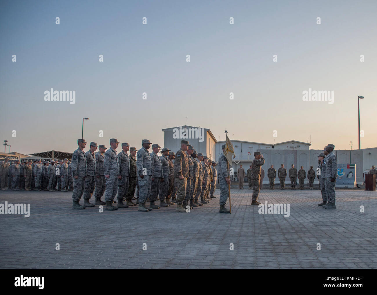 Airmen from the 380th Air Expeditionary Wing stand at attention during ...