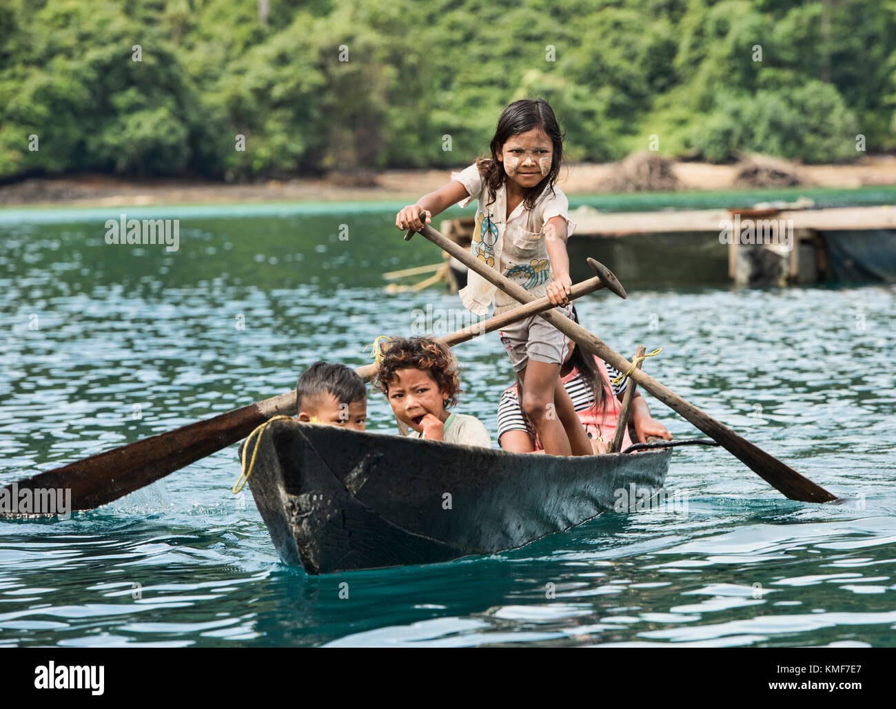 Child rowing canoe asia hi-res stock photography and images - Alamy