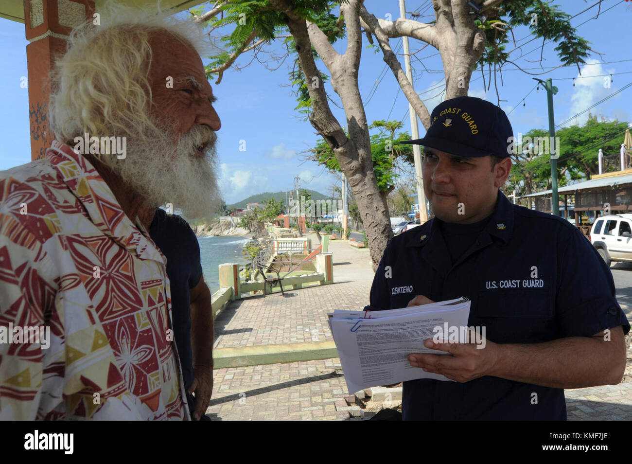 Coast Guard Petty Officer 3rd Class Jonathan Centeno, with the ...