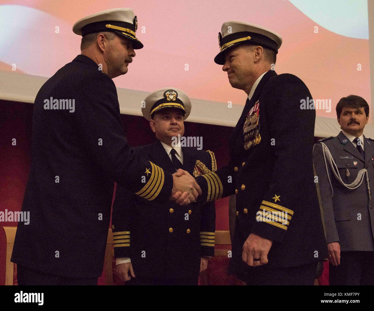 Capt. Rick Gilbert, right, congratulates Capt. Scott McClelland, left ...