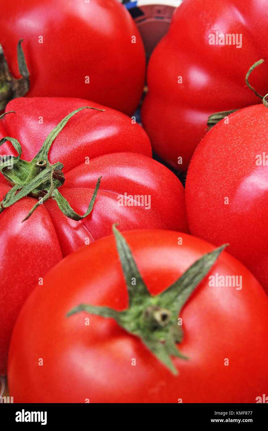 Tomato texture. Fresh big red tomatoes closeup background photo. Pile ...