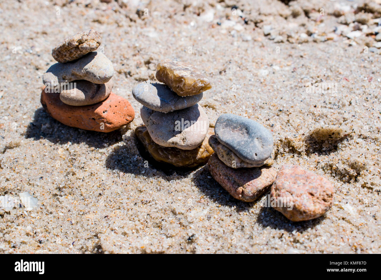 Stone pyramid on the sand near the sea Stock Photo - Alamy