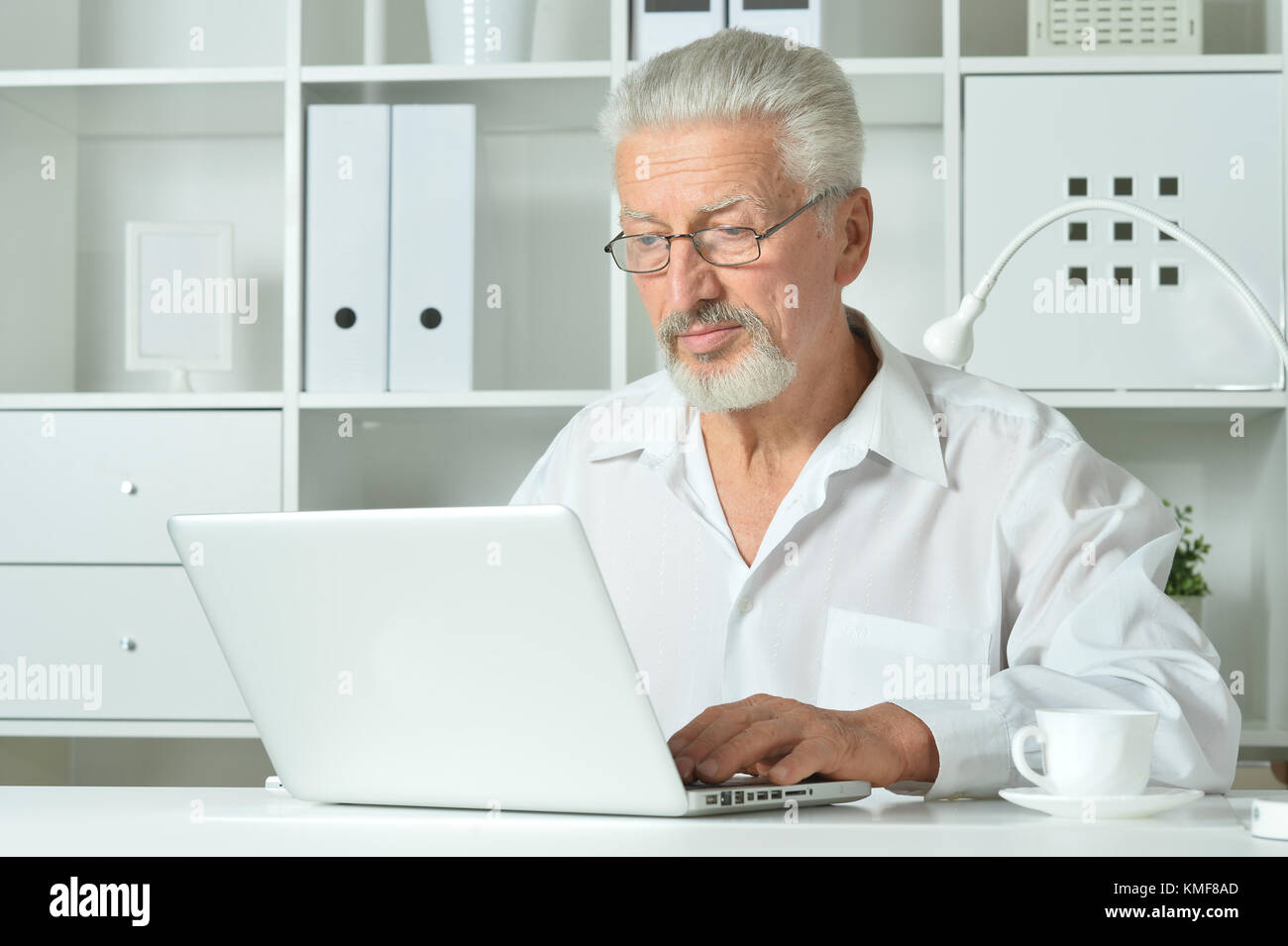 mature man using laptop Stock Photo - Alamy