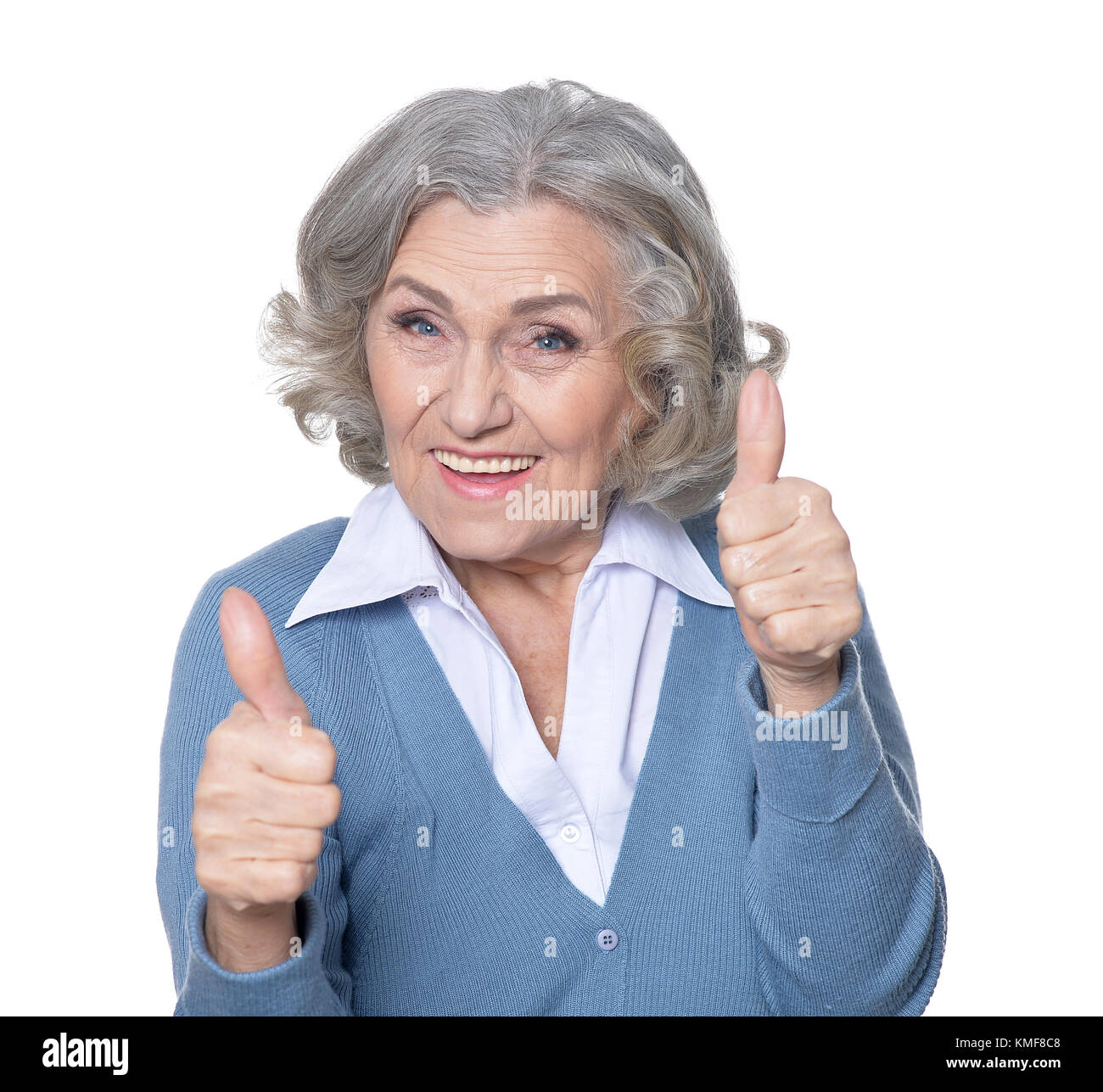 Senior woman showing thumbs up Stock Photo - Alamy