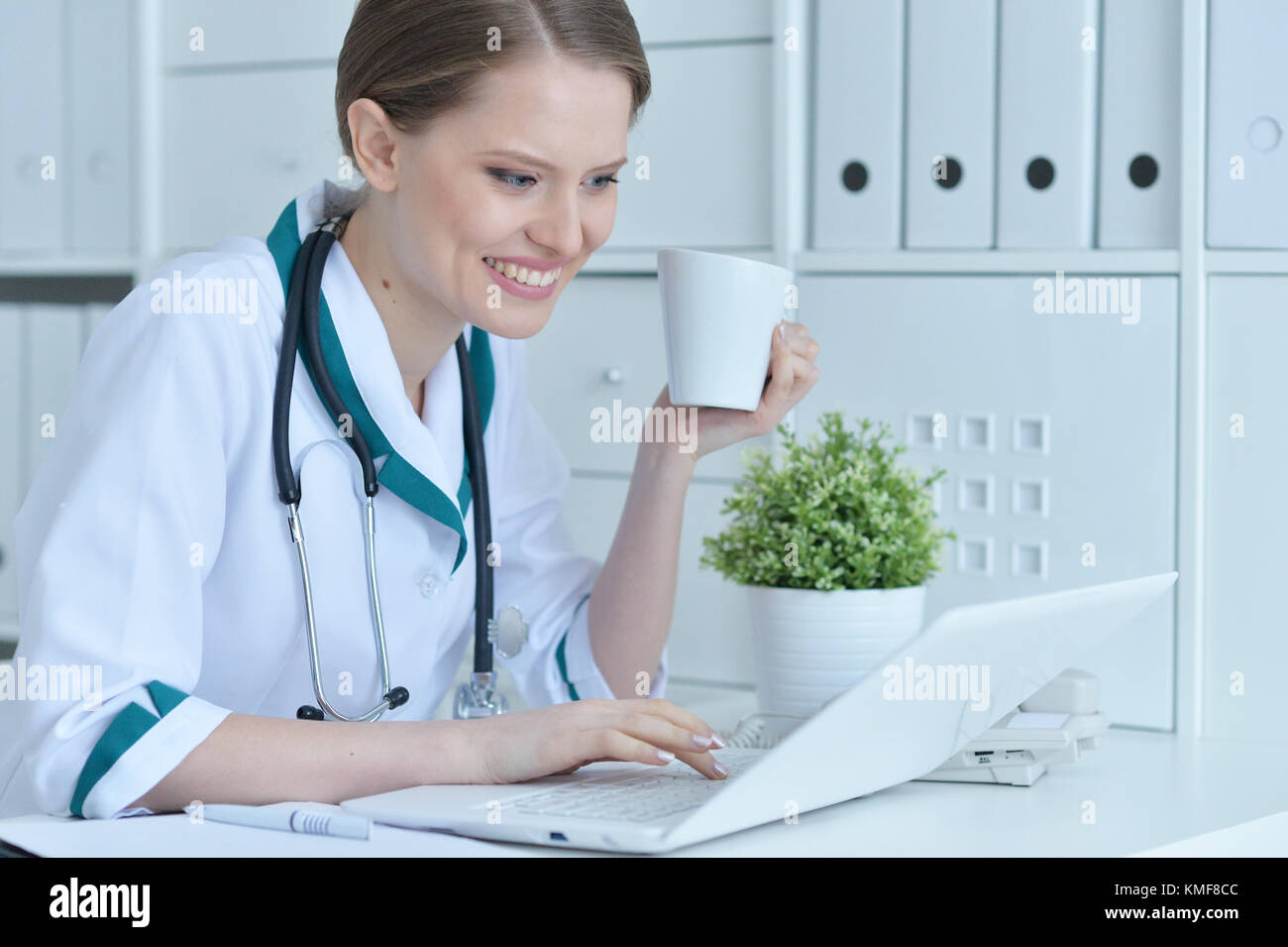 doctor working in office Stock Photo - Alamy