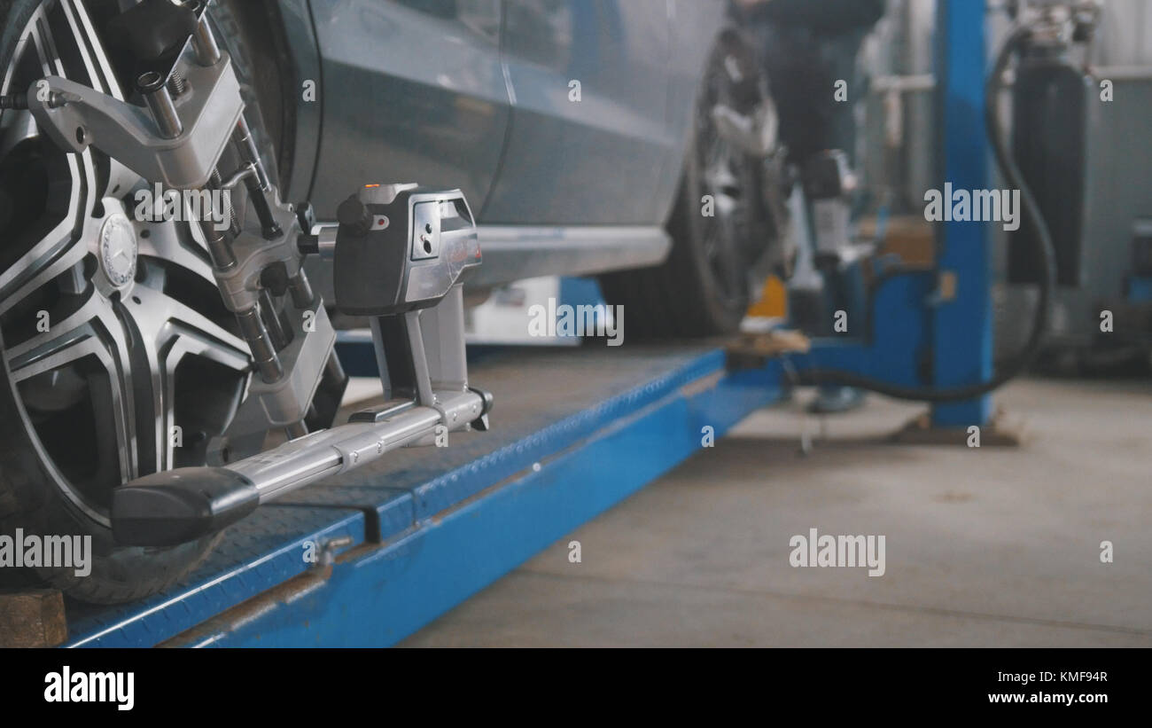 Luxury car in auto work shop service lifting for repairing Stock Photo ...