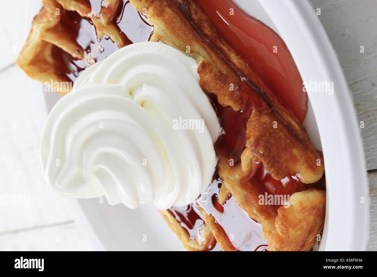 traditional waffle with cream and syrup Stock Photo - Alamy