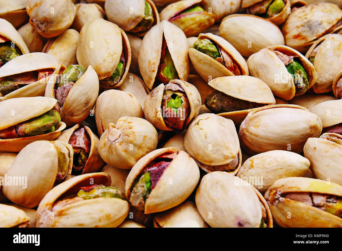 Pistachio texture. Nuts. Green fresh pistachios as texture. Roasted salted pistachio nuts ...