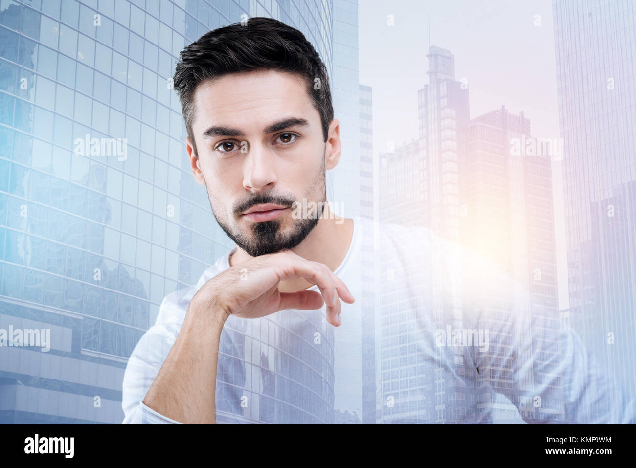 Calm handsome student sitting quietly at the lecture and listening ...