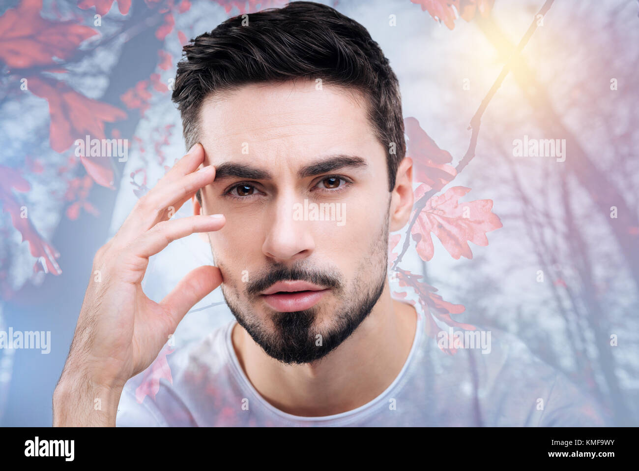 Young thoughtful man looking interested while admiring the beauty of ...