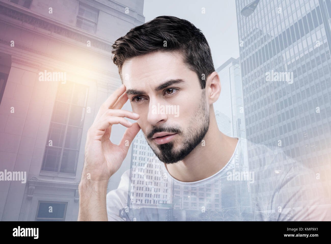 Concentrated man touching forehead hi-res stock photography and images ...