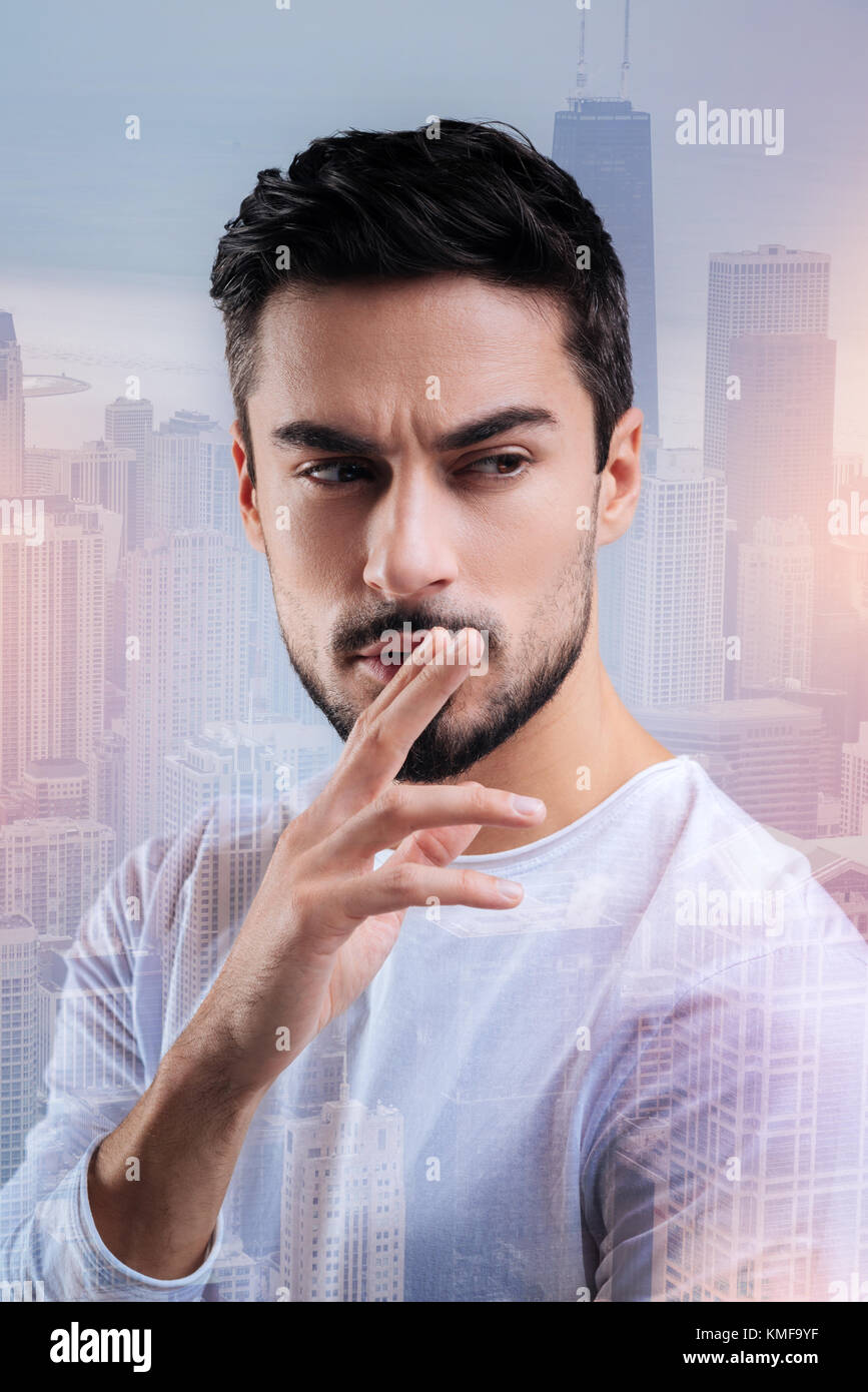 Young talented painter getting an inspiration while being alone in ...