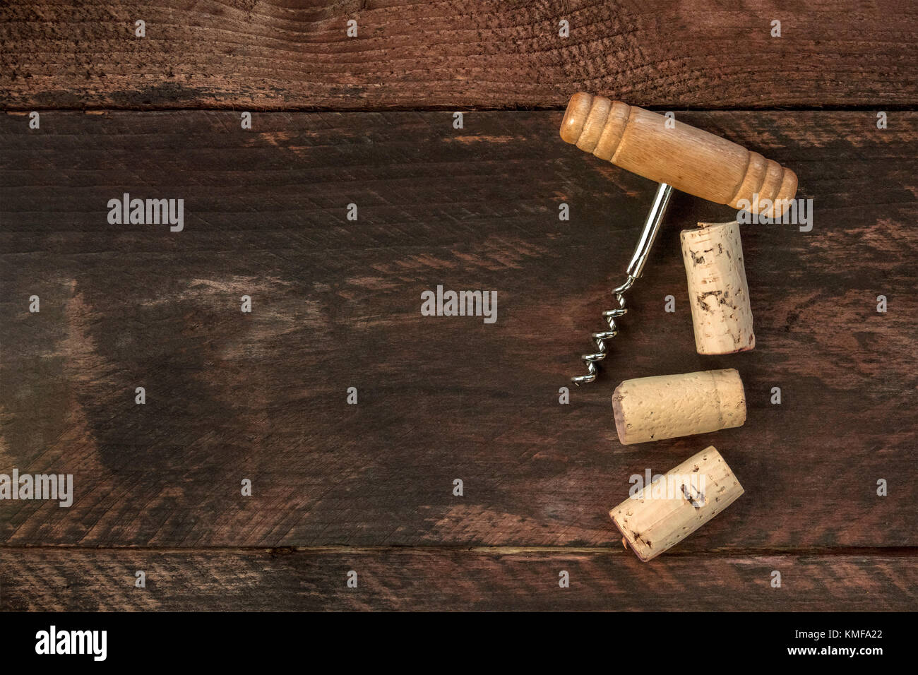 Photo of wine corkscrew and corks on dark background Stock Photo - Alamy