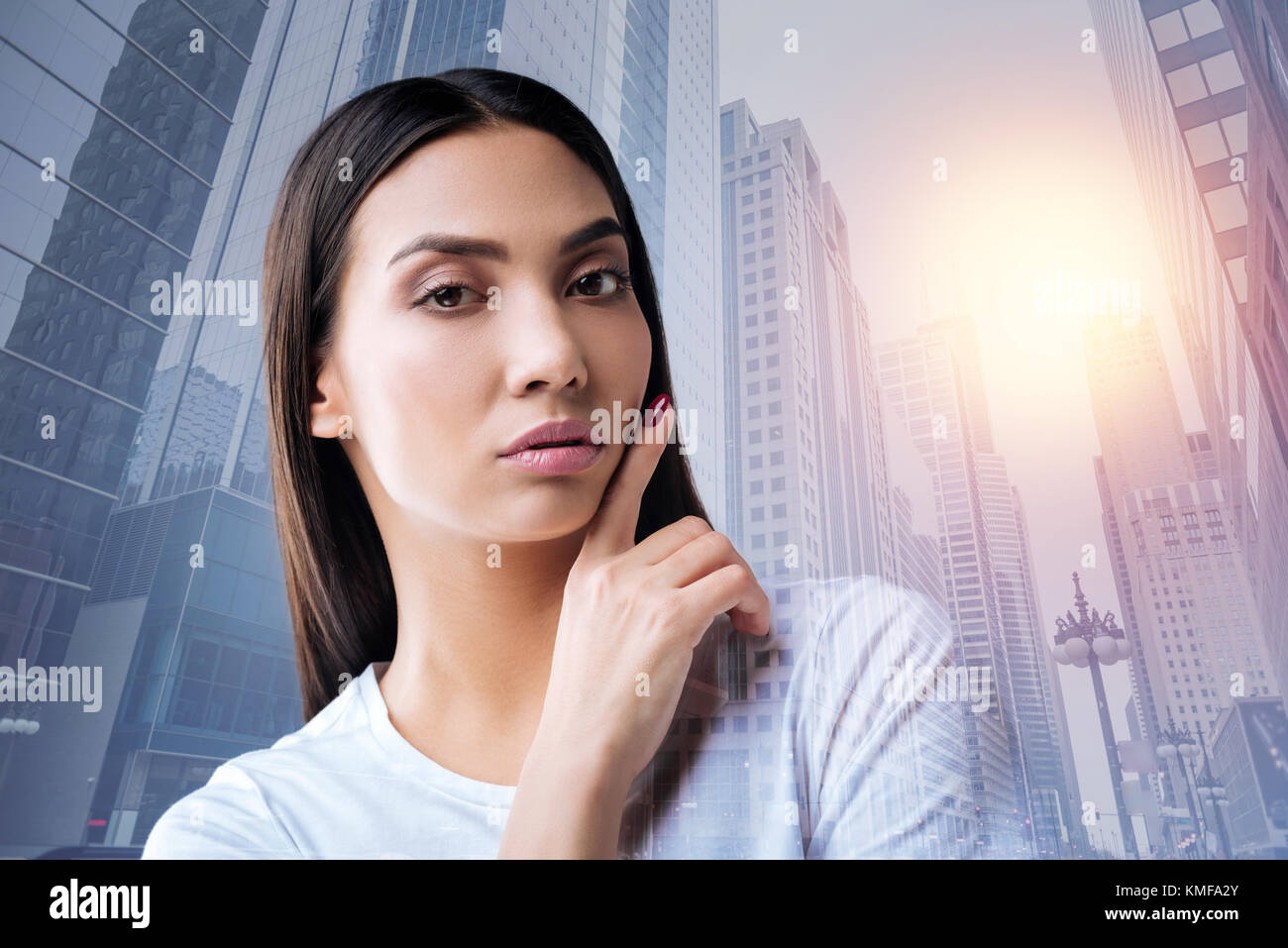Calm beautiful woman standing alone and looking interested Stock Photo ...