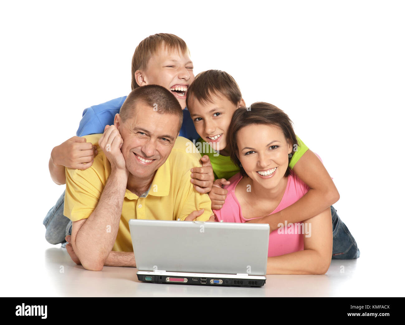 Parents with sons using laptop Stock Photo - Alamy