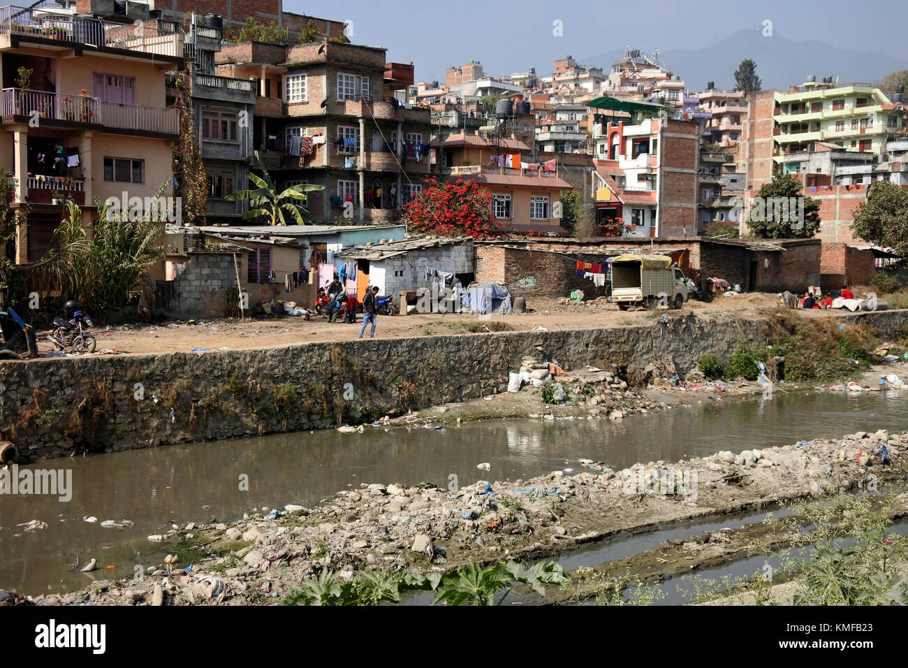 Mounts of plastic bags, dust and build up over many years in a river ...