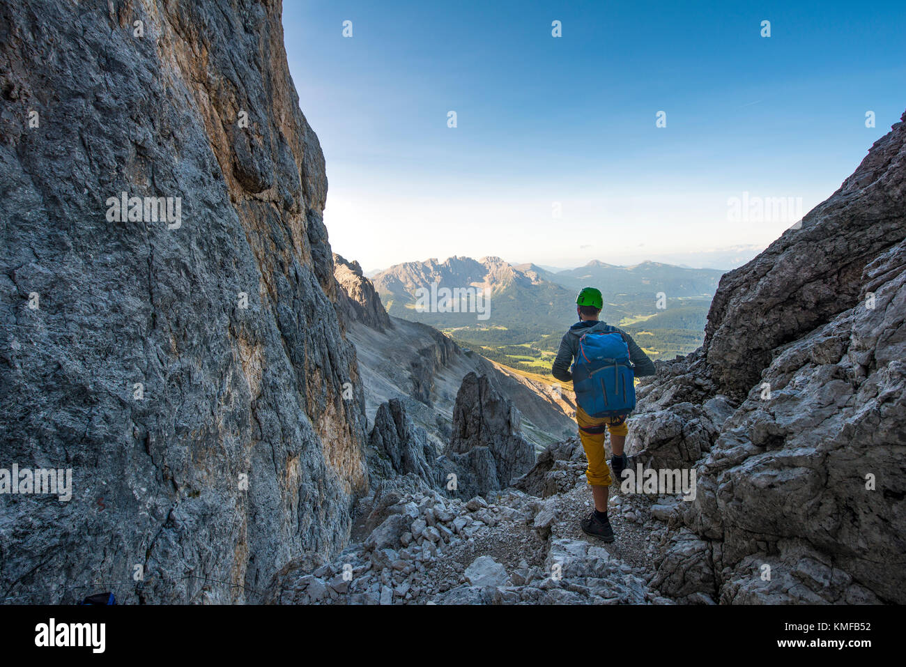 Hiker in the Santner via ferrata, rose garden group, view of the ...