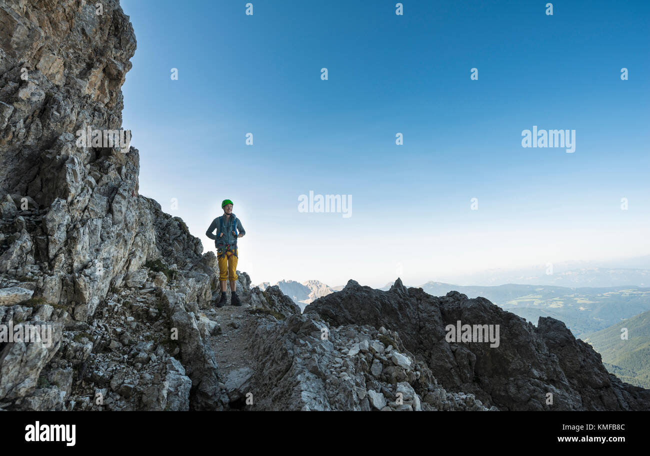 Hiker on the Santner via ferrata, Rosengarten Group, Dolomites, South ...