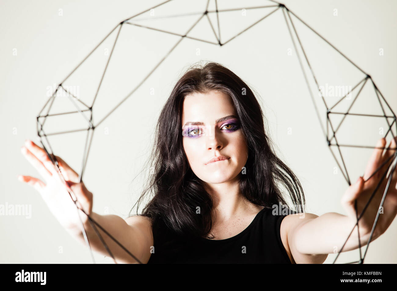 Female holding model of geometric solid Stock Photo - Alamy