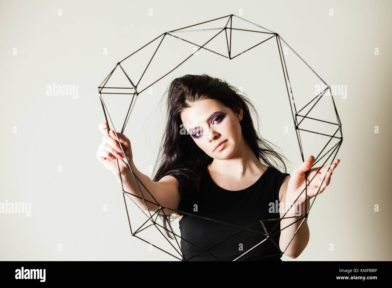 Female holding model of geometric solid Stock Photo - Alamy
