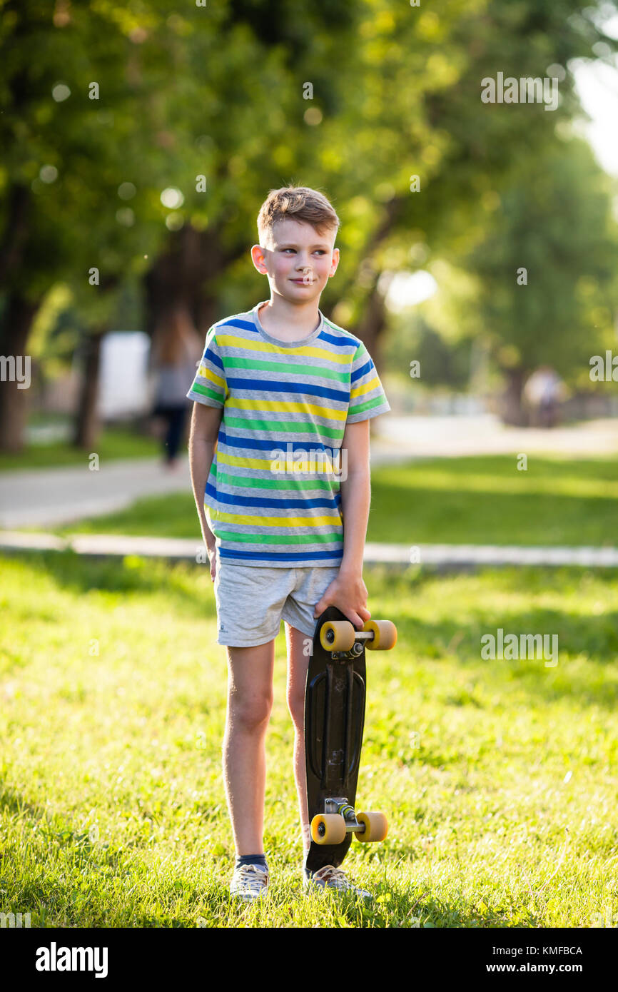 Boy riding a skateboard Stock Photo - Alamy