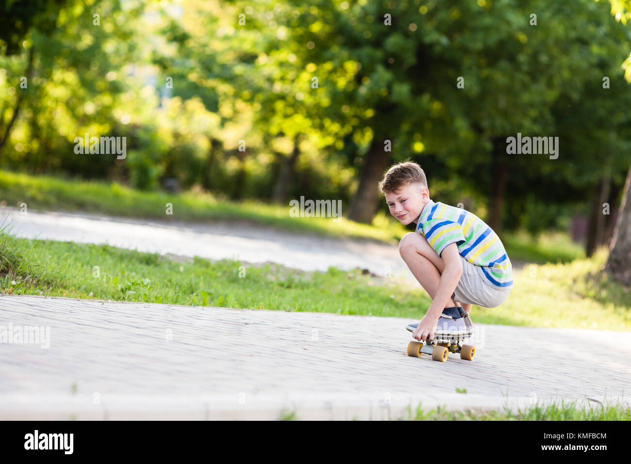 Boy riding a skateboard Stock Photo - Alamy