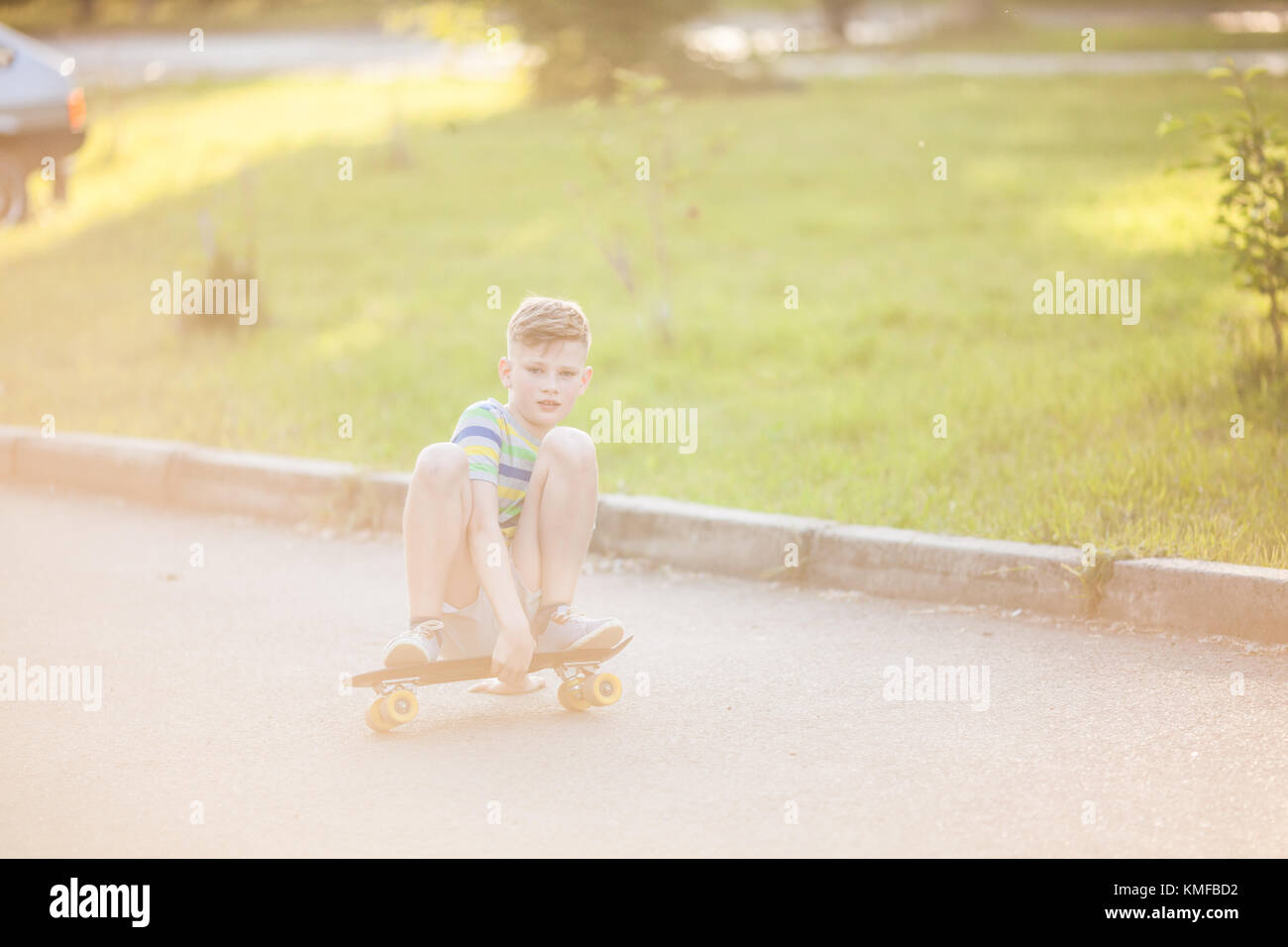 Boy riding a skateboard Stock Photo - Alamy