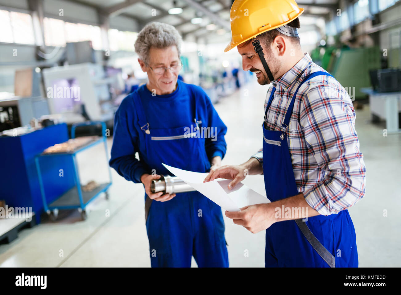 Team Of Engineers Having Discussion In Factory Stock Photo - Alamy