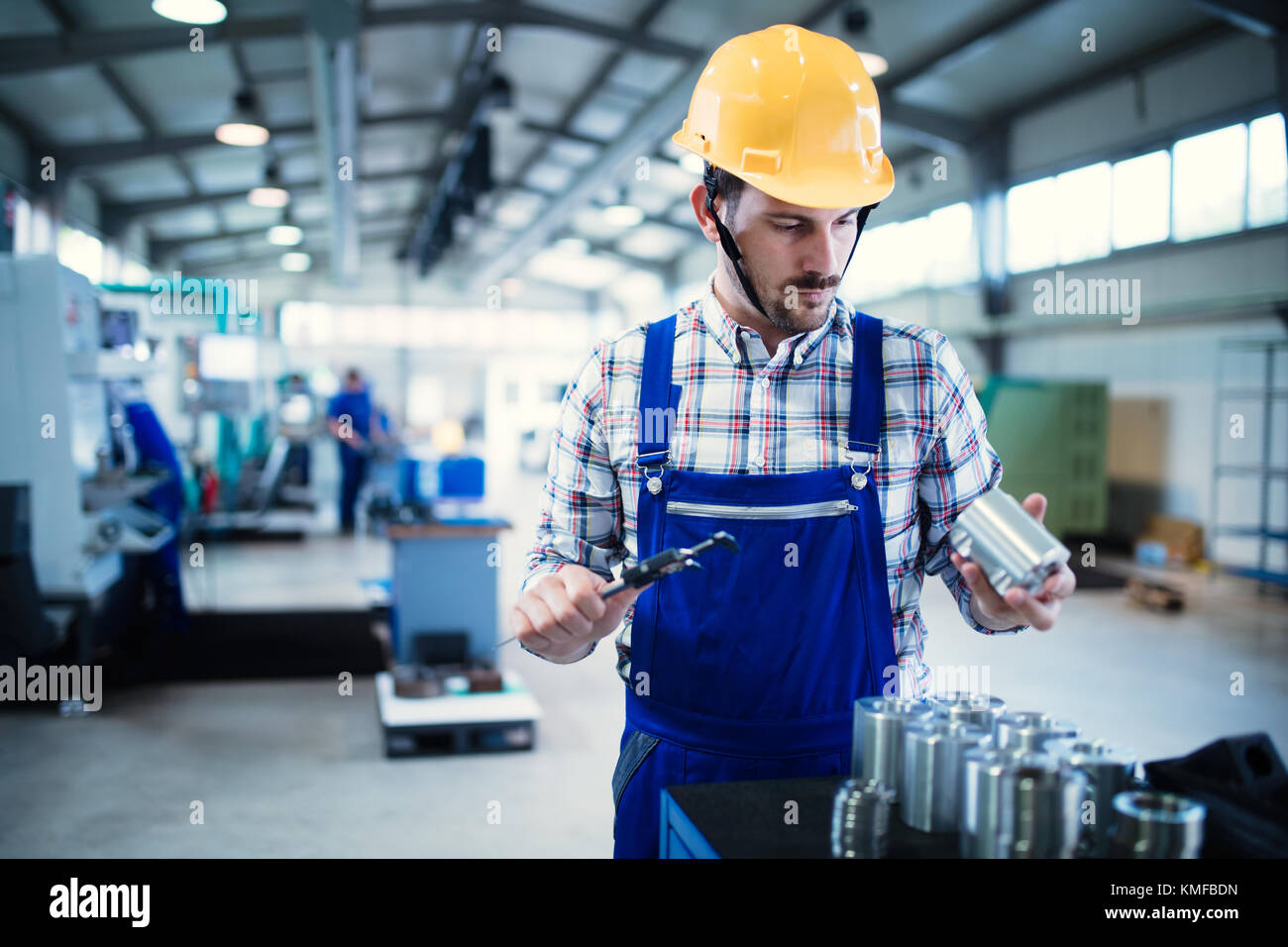modern industrial machine operator working in factory Stock Photo - Alamy