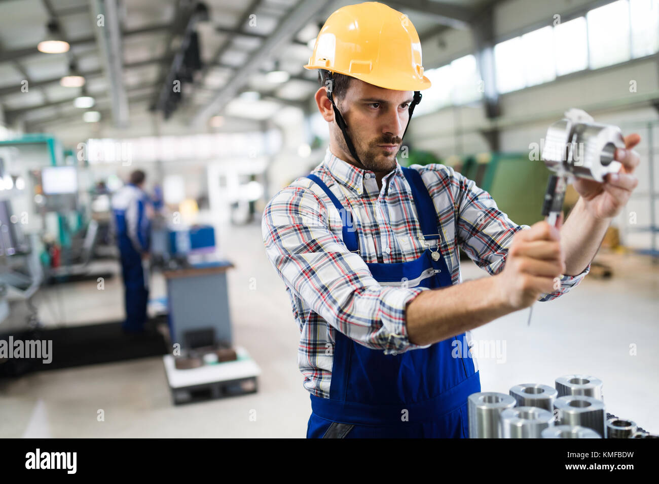 modern industrial machine operator working in factory Stock Photo - Alamy