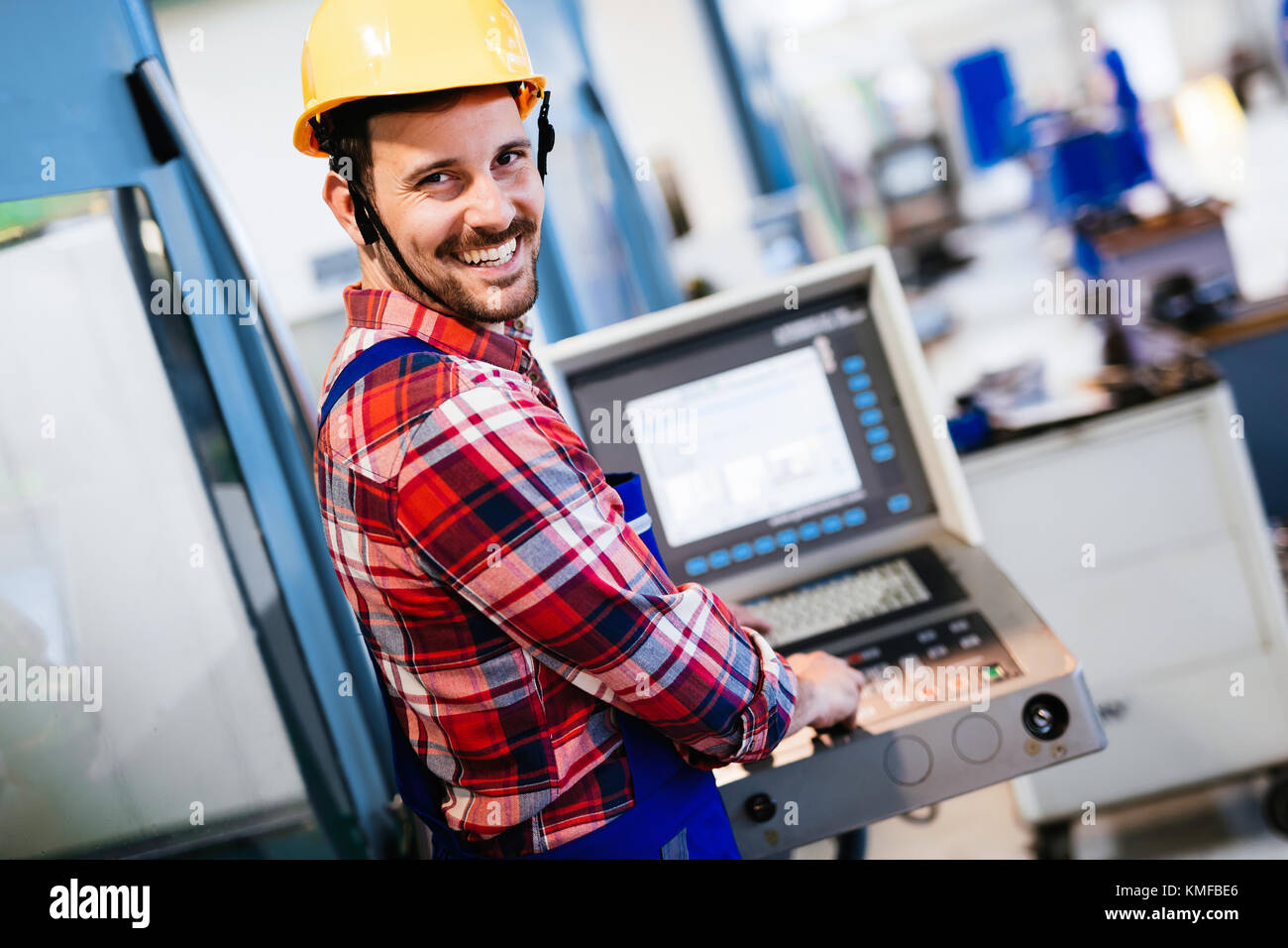 modern industrial machine operator working in factory Stock Photo - Alamy