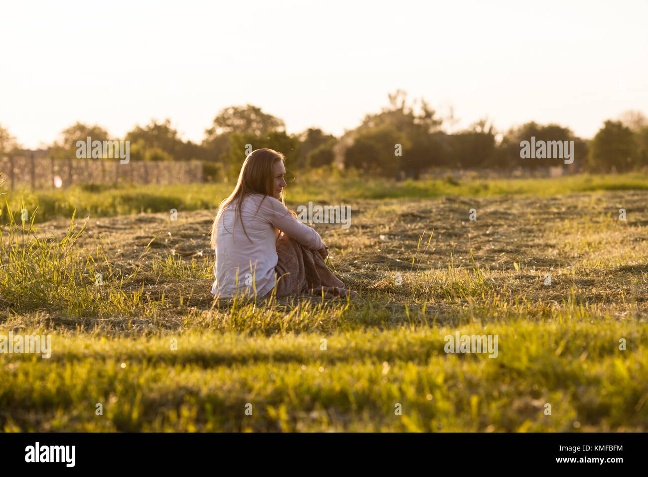 The girl in the field Stock Photo - Alamy