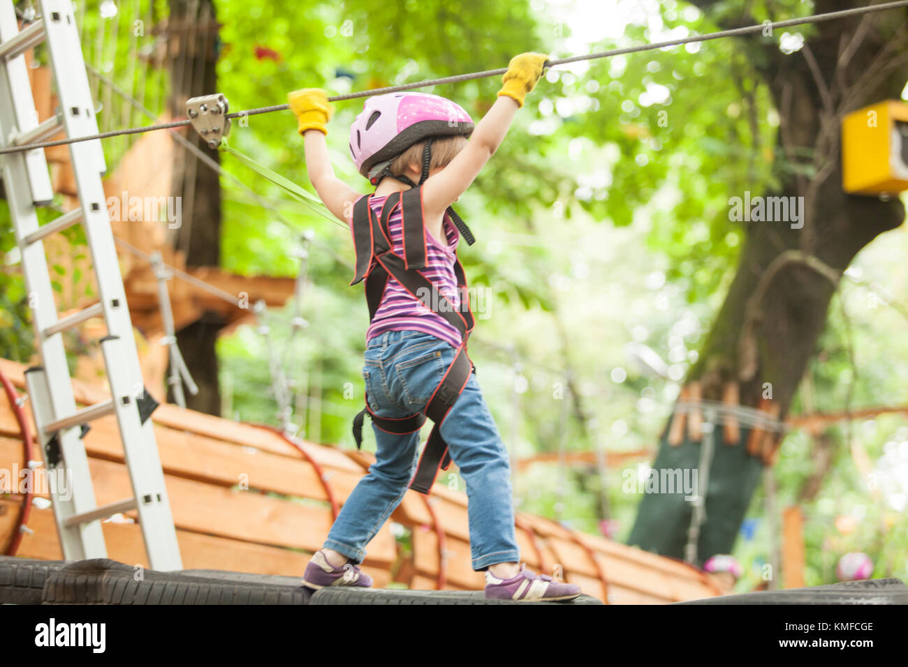 The obstacle course in adventure park Stock Photo - Alamy