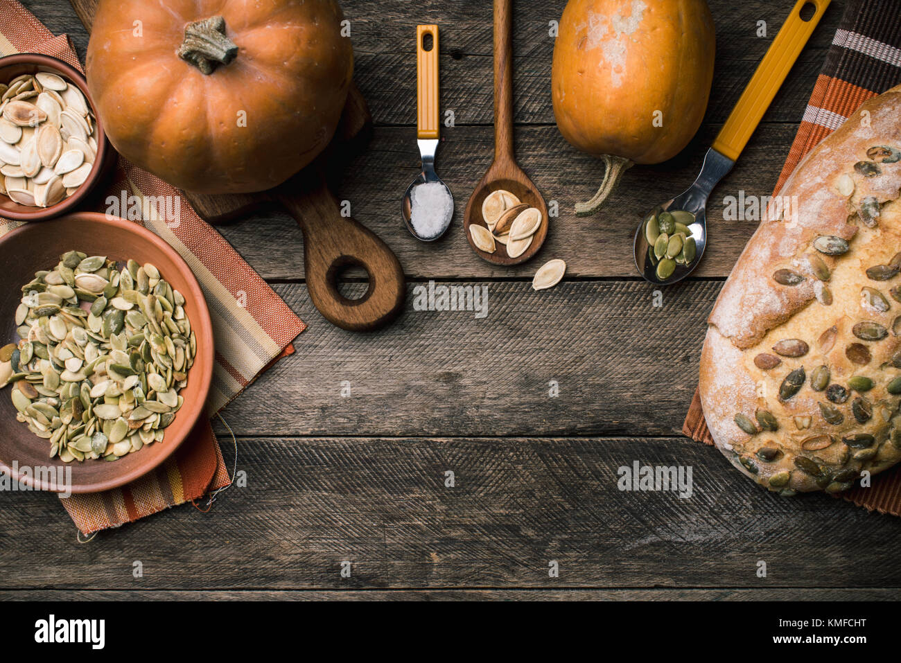 Rustic pumpkins with bread and seeds on wood. Autumn Season food photo ...