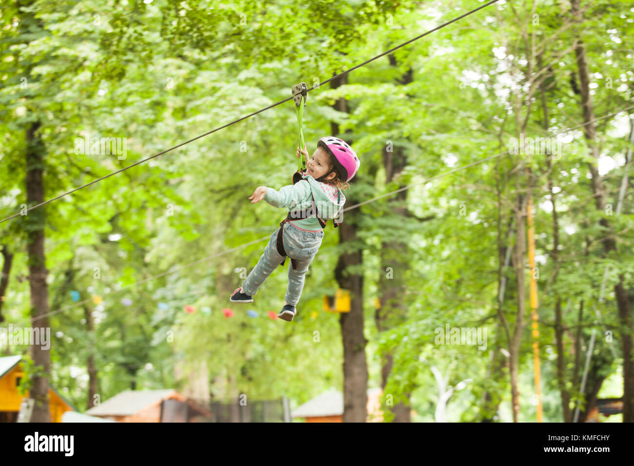 Child in a adventure playground Stock Photo - Alamy