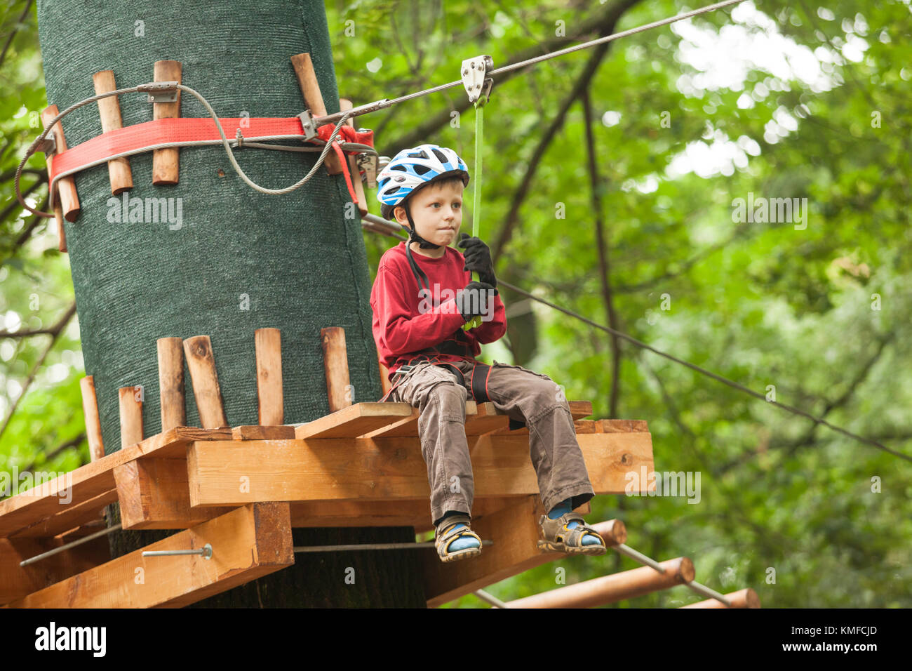 Child in a adventure playground Stock Photo - Alamy