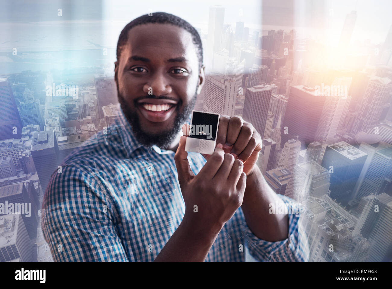 Happy nice man showing you an engagement ring Stock Photo - Alamy