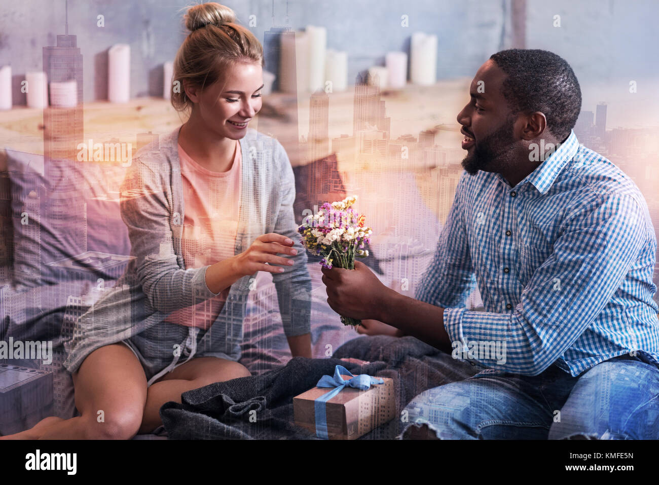 Happy delighted woman looking at the bouquet Stock Photo - Alamy