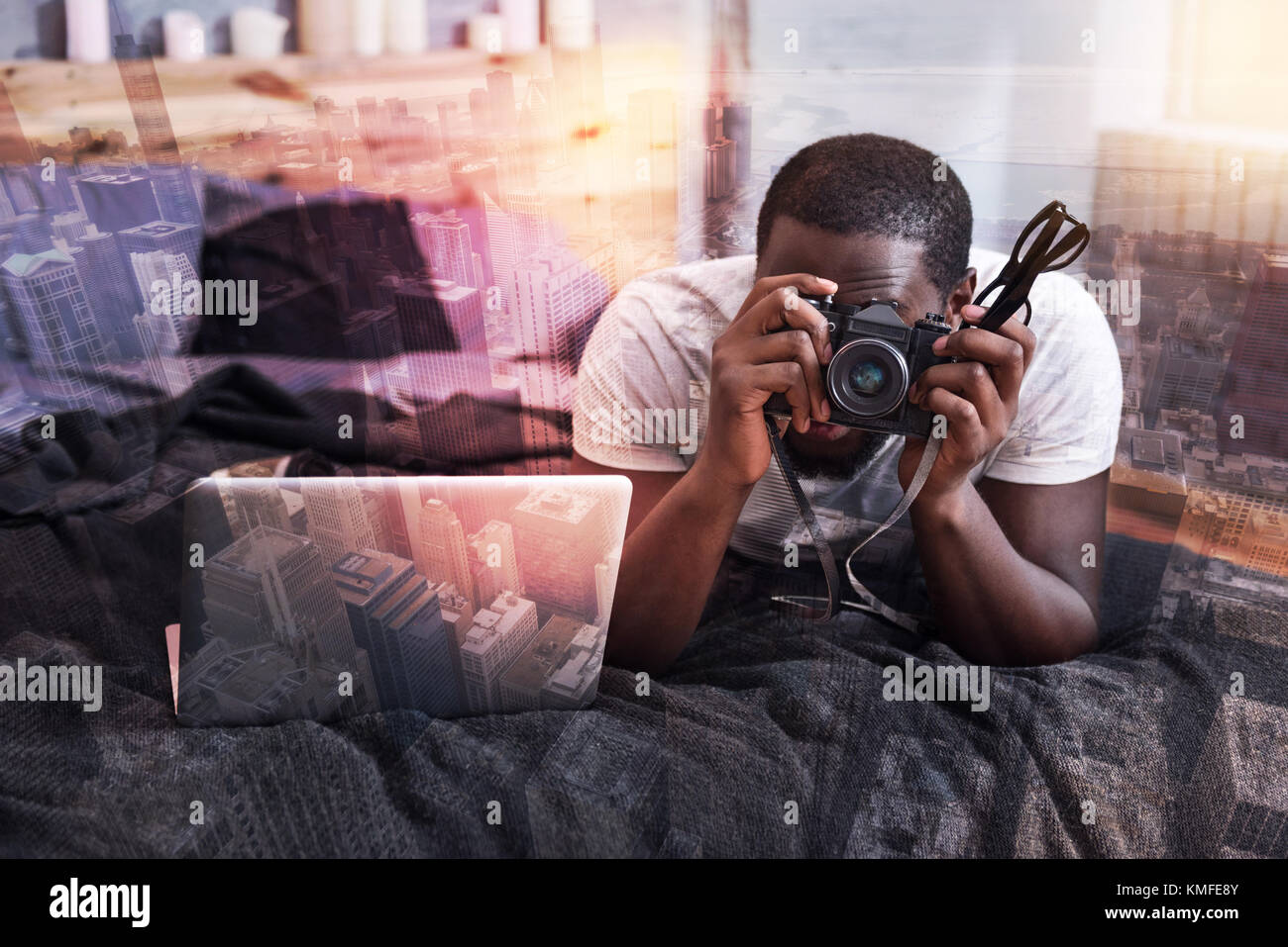 Handsome talented man using his camera Stock Photo - Alamy