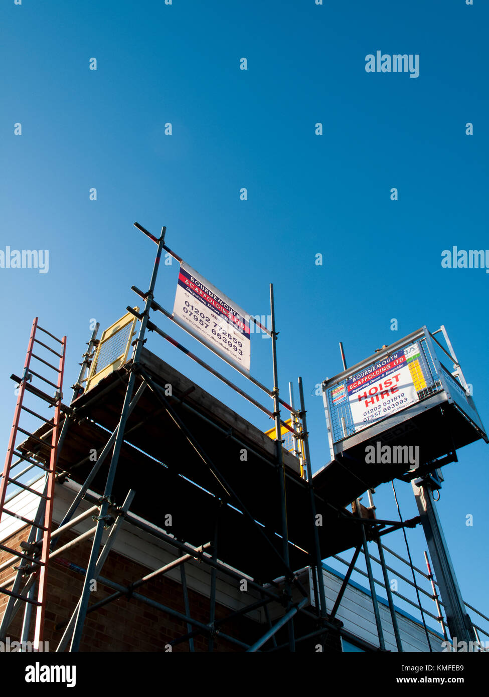 Scaffolding and hoist to residential building undergoing renovation ...