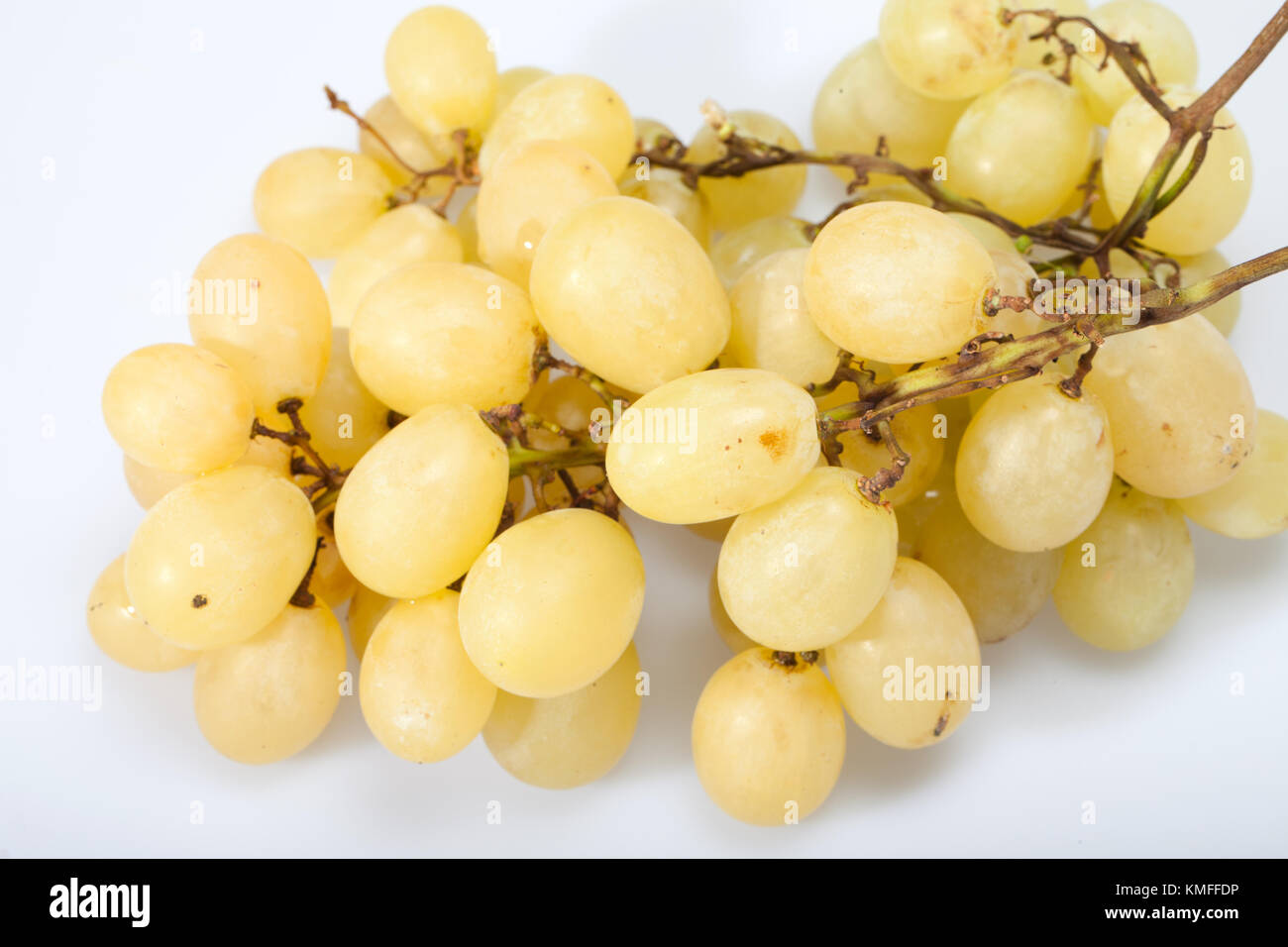 Sweet and ripe white grapes isolated on white Stock Photo - Alamy