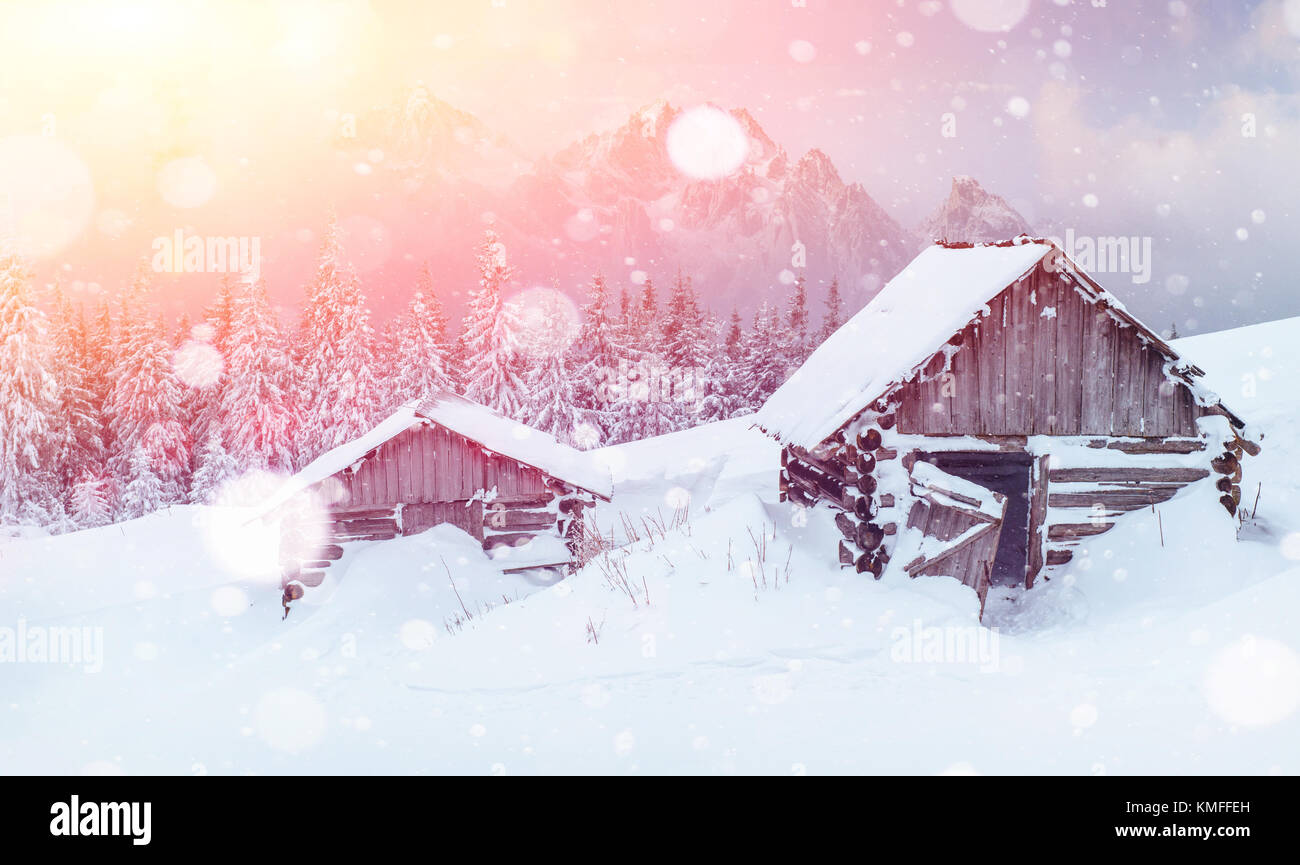 Hut in the mountains in winter, background with some soft highlights ...