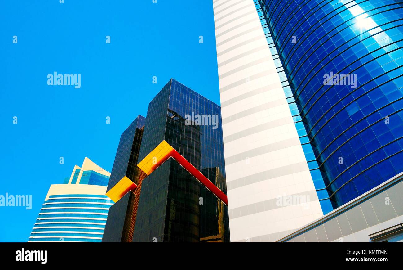 City centre Doha, Qatar. Towers line Majlis Al Taawon Street. L-R Qatar ...