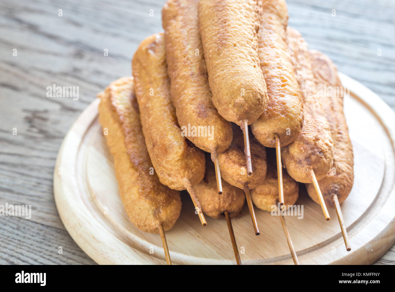Stack of corn dogs on the wooden board Stock Photo - Alamy