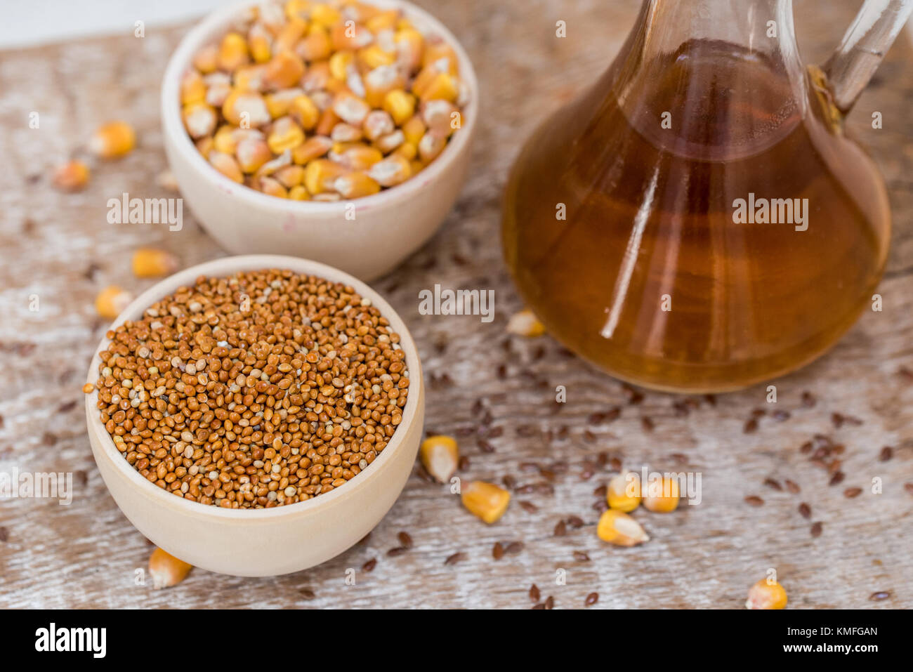 Corn and millet grain in wooden bowls and oil Stock Photo - Alamy
