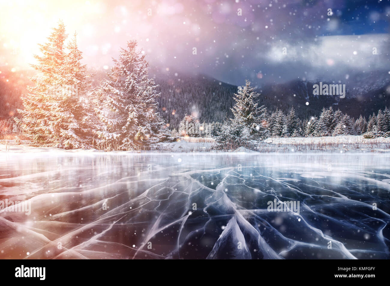 Blue ice and cracks on the surface of the ice. Frozen lake in winter ...