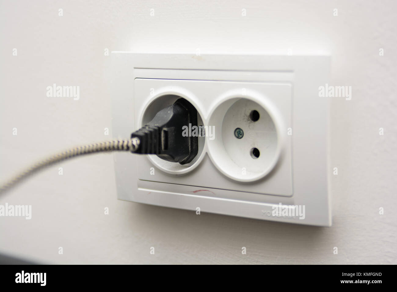 Close up plug in the socket Stock Photo - Alamy