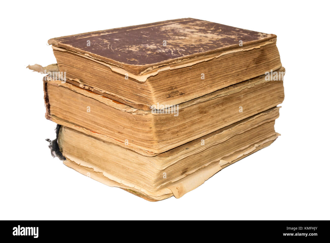 A stack of old tattered books. Vintage torn books. Antiques isolated ...