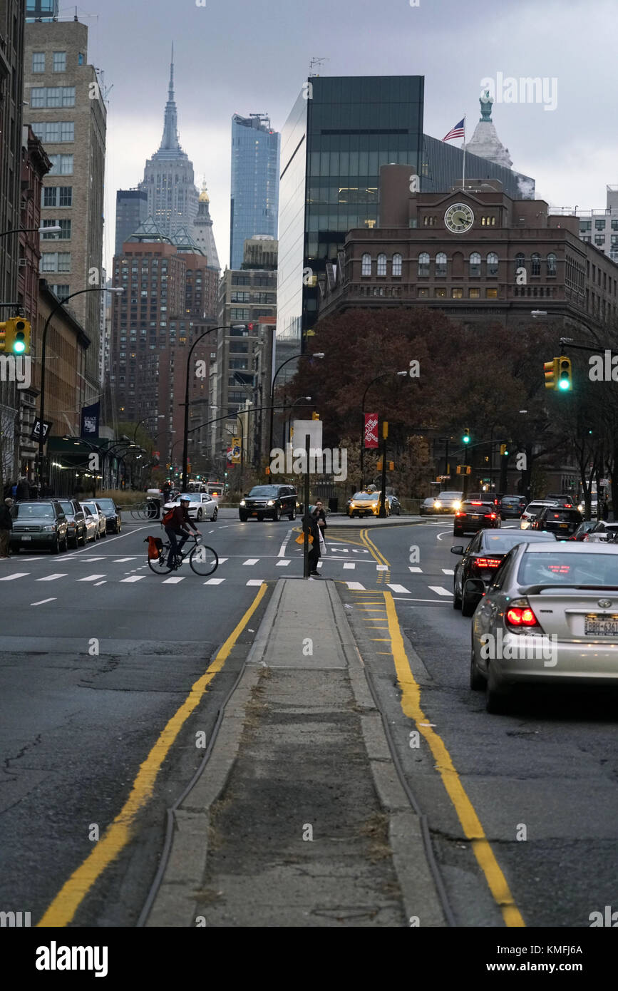 Bowery Street with Cooper Square and skyline of midtown Manhattan in ...