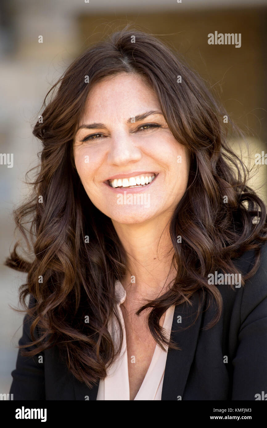 Happy mature businesswoman at work Stock Photo - Alamy